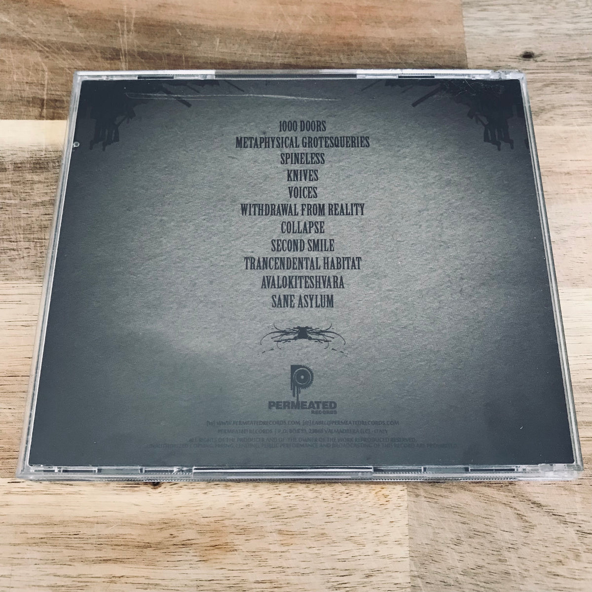 Infested - 1000 Doors CD - Permeated Records – METEOR GEM